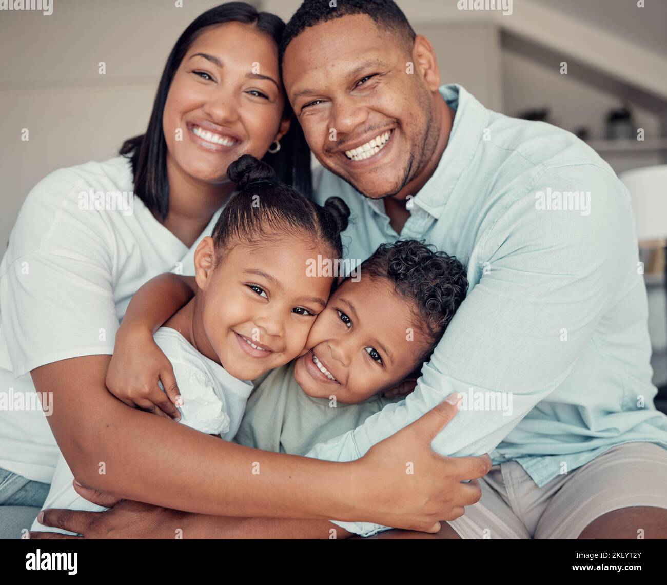 Happy, smile and portrait of family hugging, bonding and relaxing ...