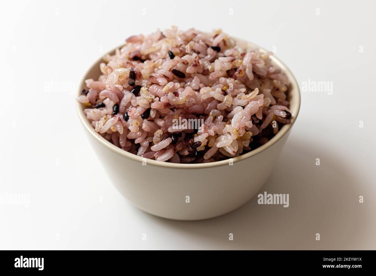 Black rice on a white background Stock Photo - Alamy