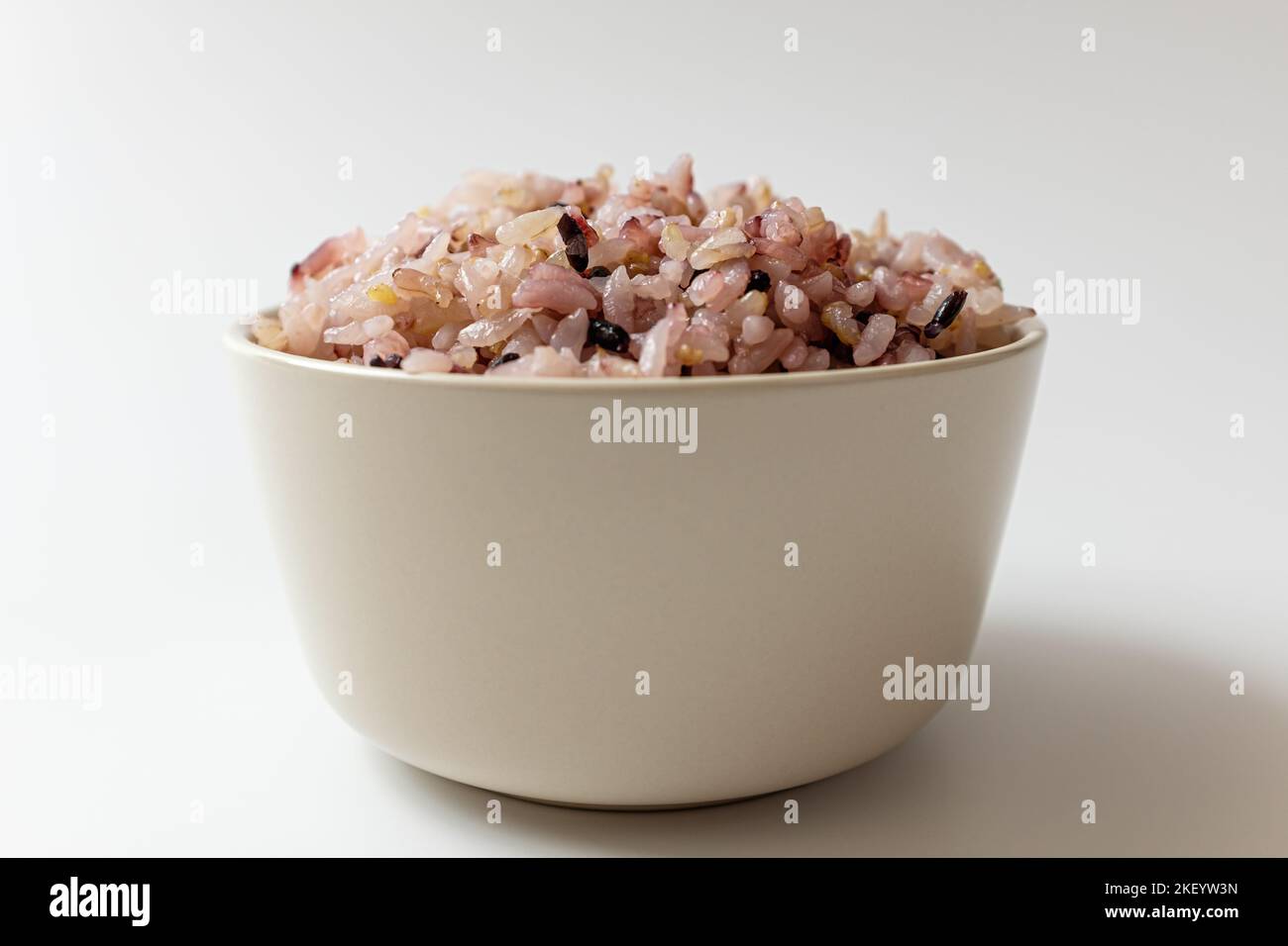 Black rice on a white background Stock Photo - Alamy