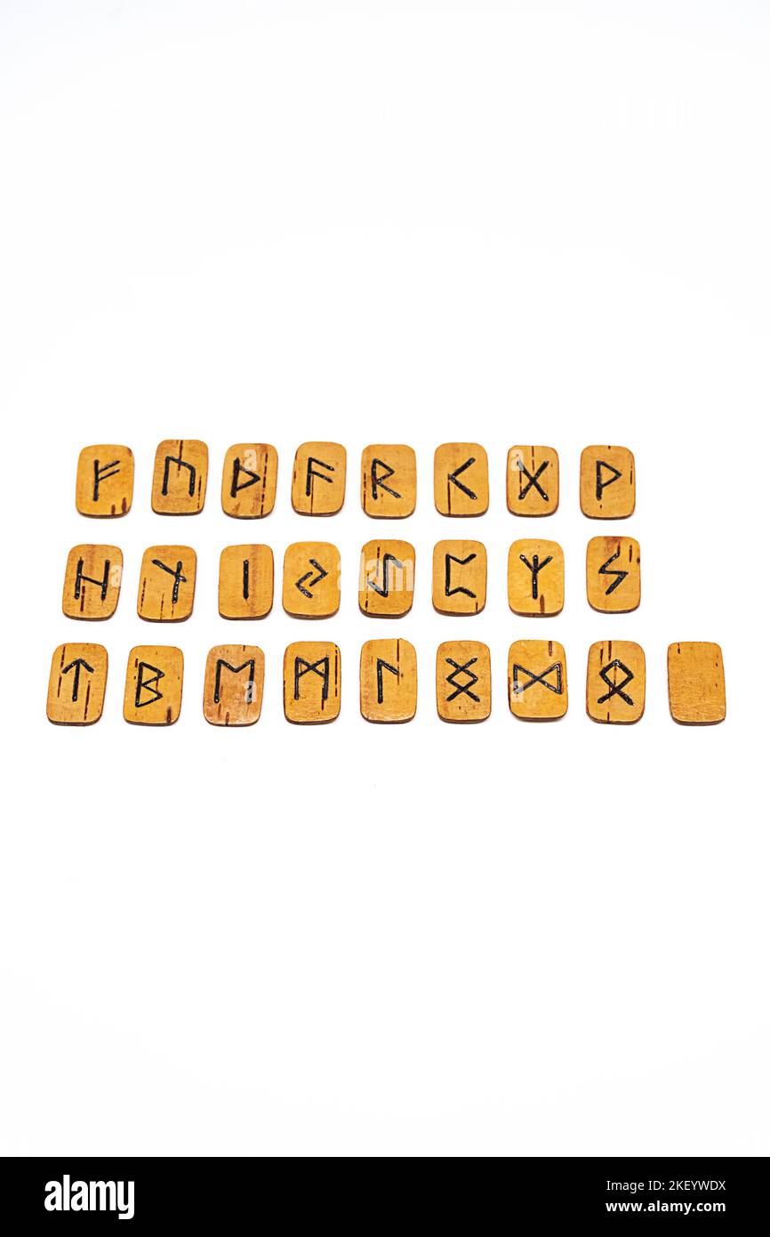Handmade wooden runes on white. Set of Scandinavian runes for ...
