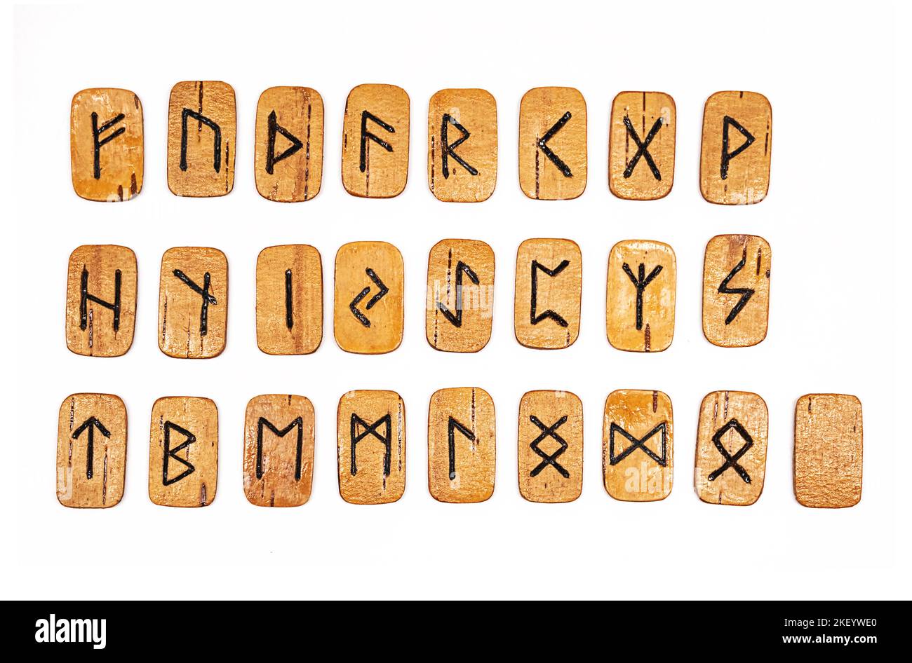 Handmade wooden runes on white. Set of Scandinavian runes for ...