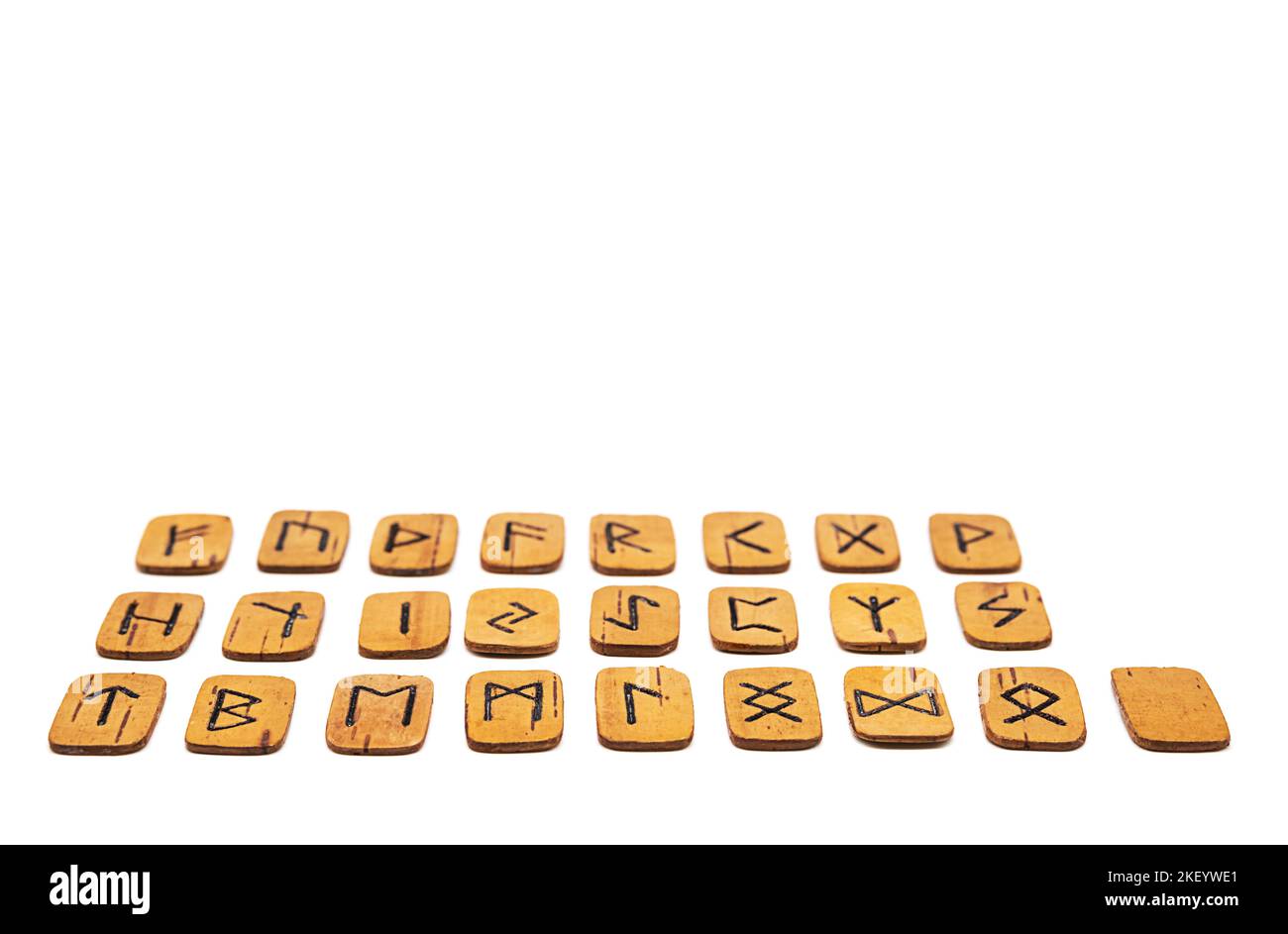 Handmade wooden runes on white. Set of Scandinavian runes for ...