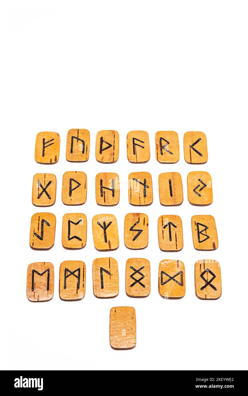 Handmade wooden runes on white. Set of Scandinavian runes for ...