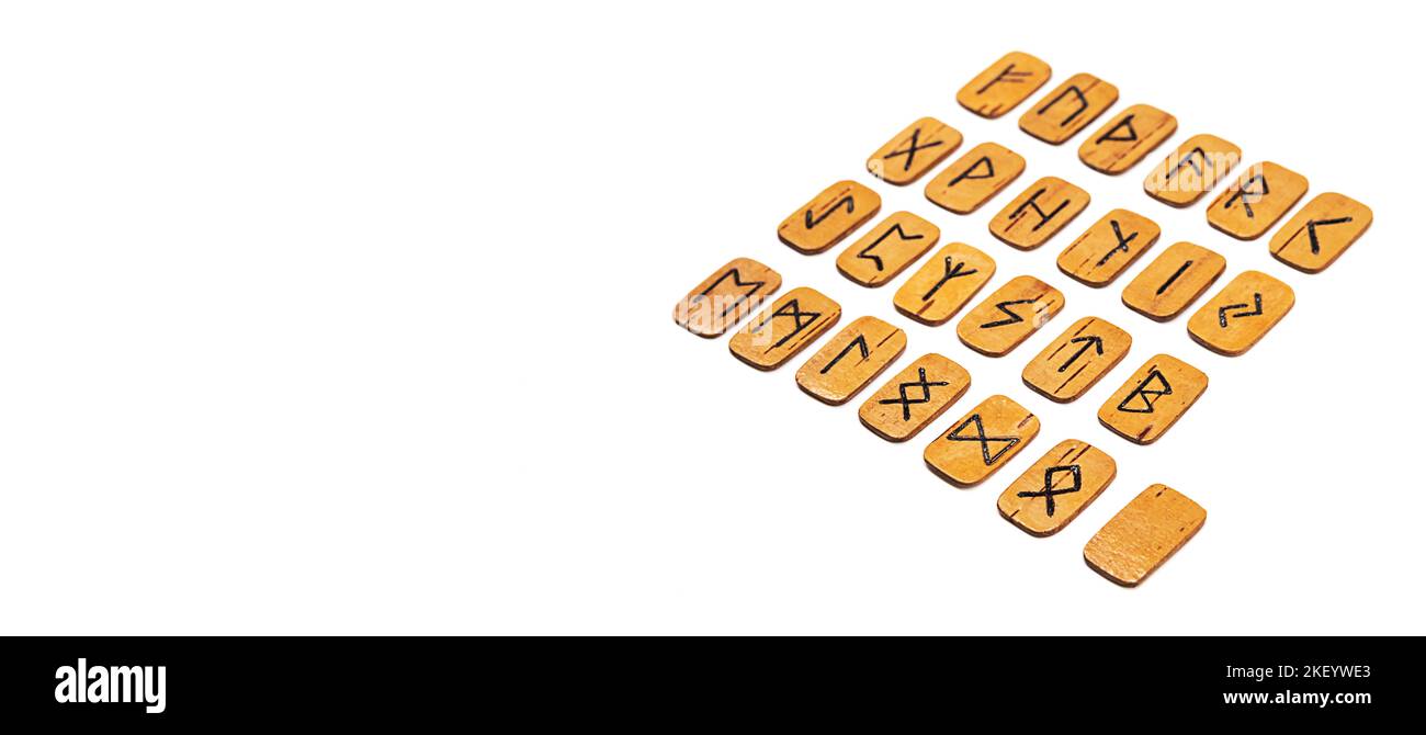 Handmade wooden runes on white. Set of Scandinavian runes for ...