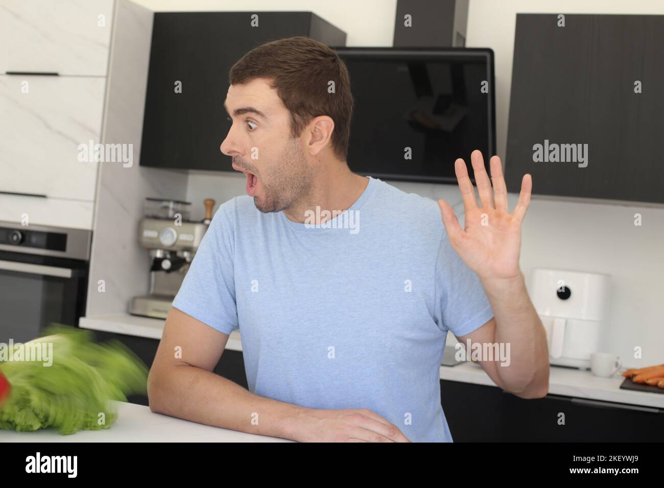Man panicking in the kitchen Stock Photo - Alamy