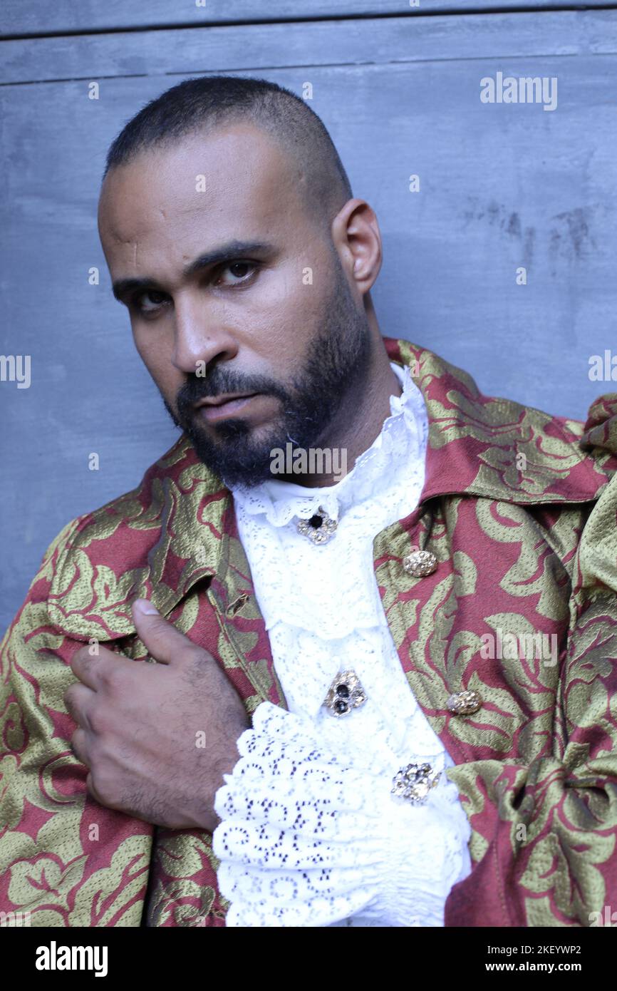 Ethnic man wearing baroque style outfit Stock Photo - Alamy