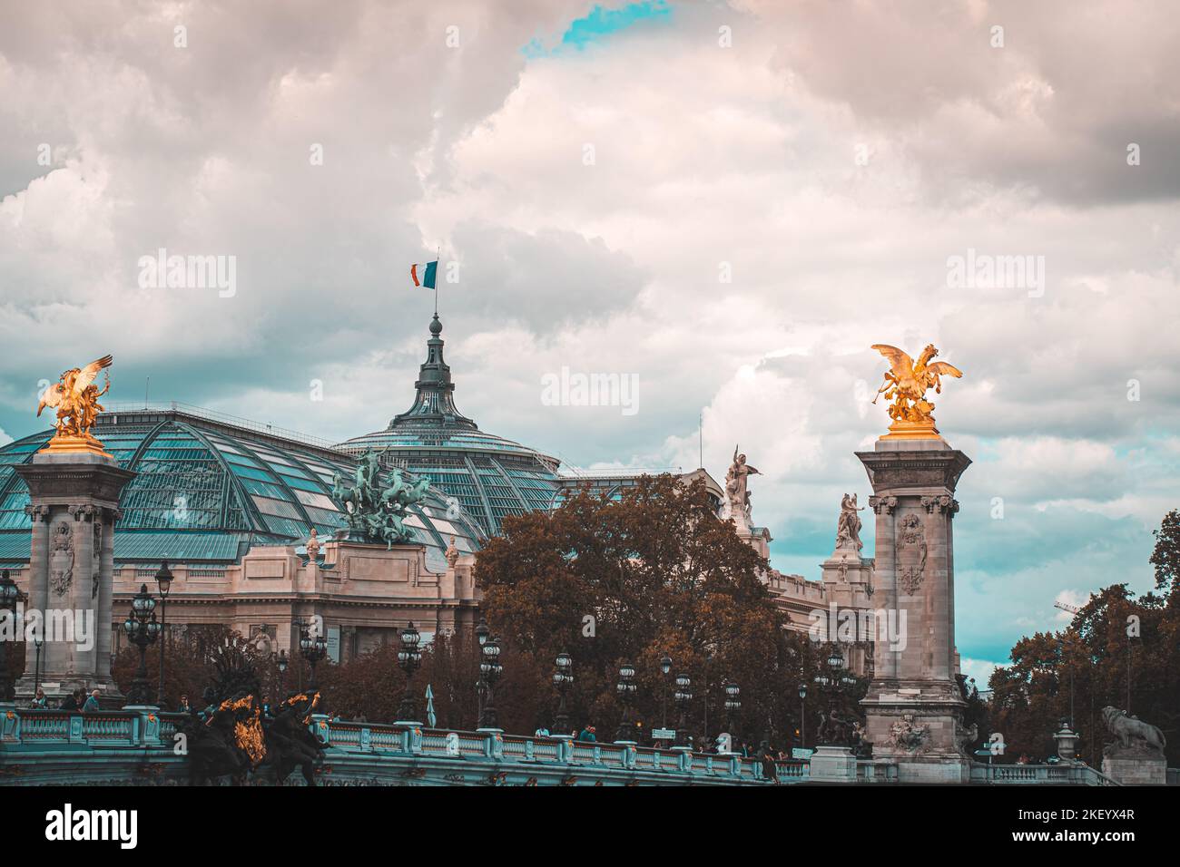 A high-angle of Alexander III bridge and autumn cityscape over, gloomy ...