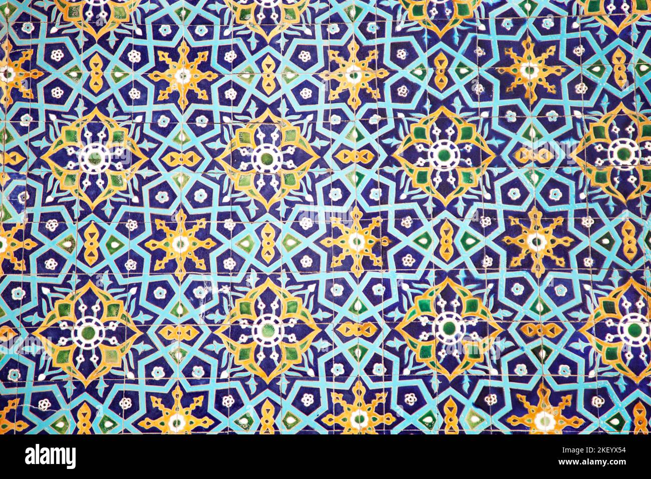 Traditional uzbek pattern on the ceramic tile on the wall of the mosque ...