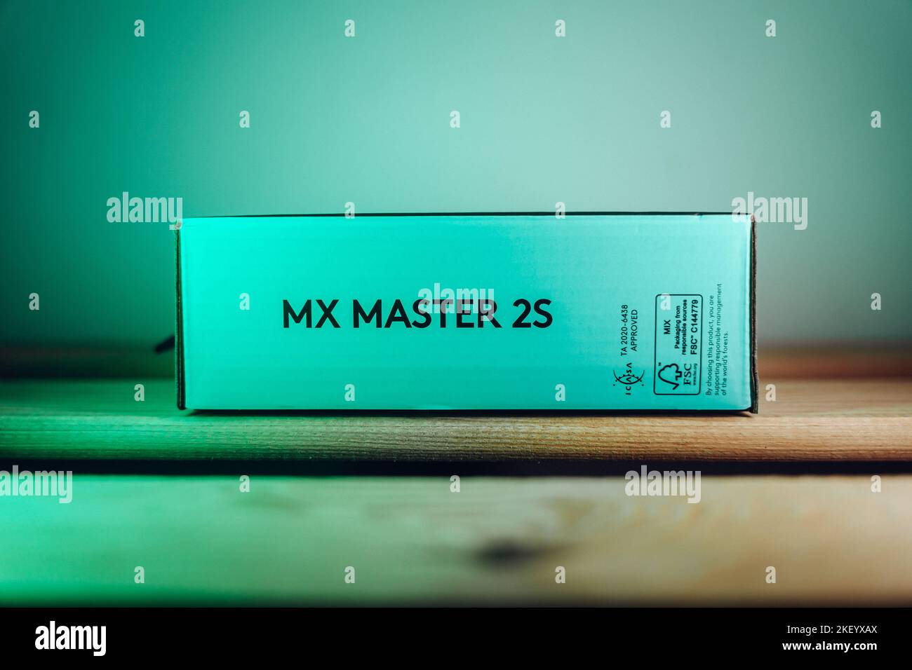 A vertical closeup of a black mouse from Logitech in the box, MX Master ...