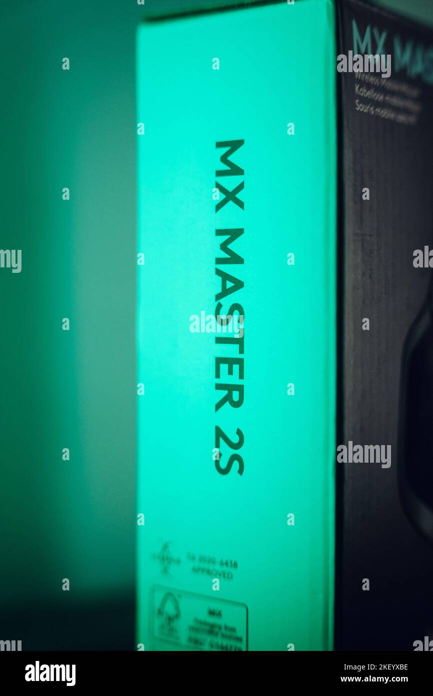 A vertical top closeup of a black mouse from Logitech in the box, MX ...