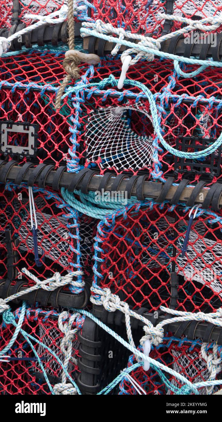 Stack of lobster pots on a quayside in Whitby, North Yorkshire, England ...