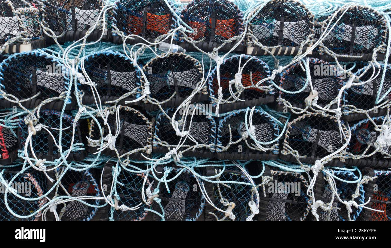 Stack of lobster pots on a quayside in Cornwall Stock Photo - Alamy