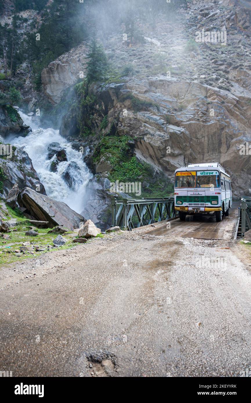 Bus crossing a bridge beside a waterfall in India Stock Photo - Alamy
