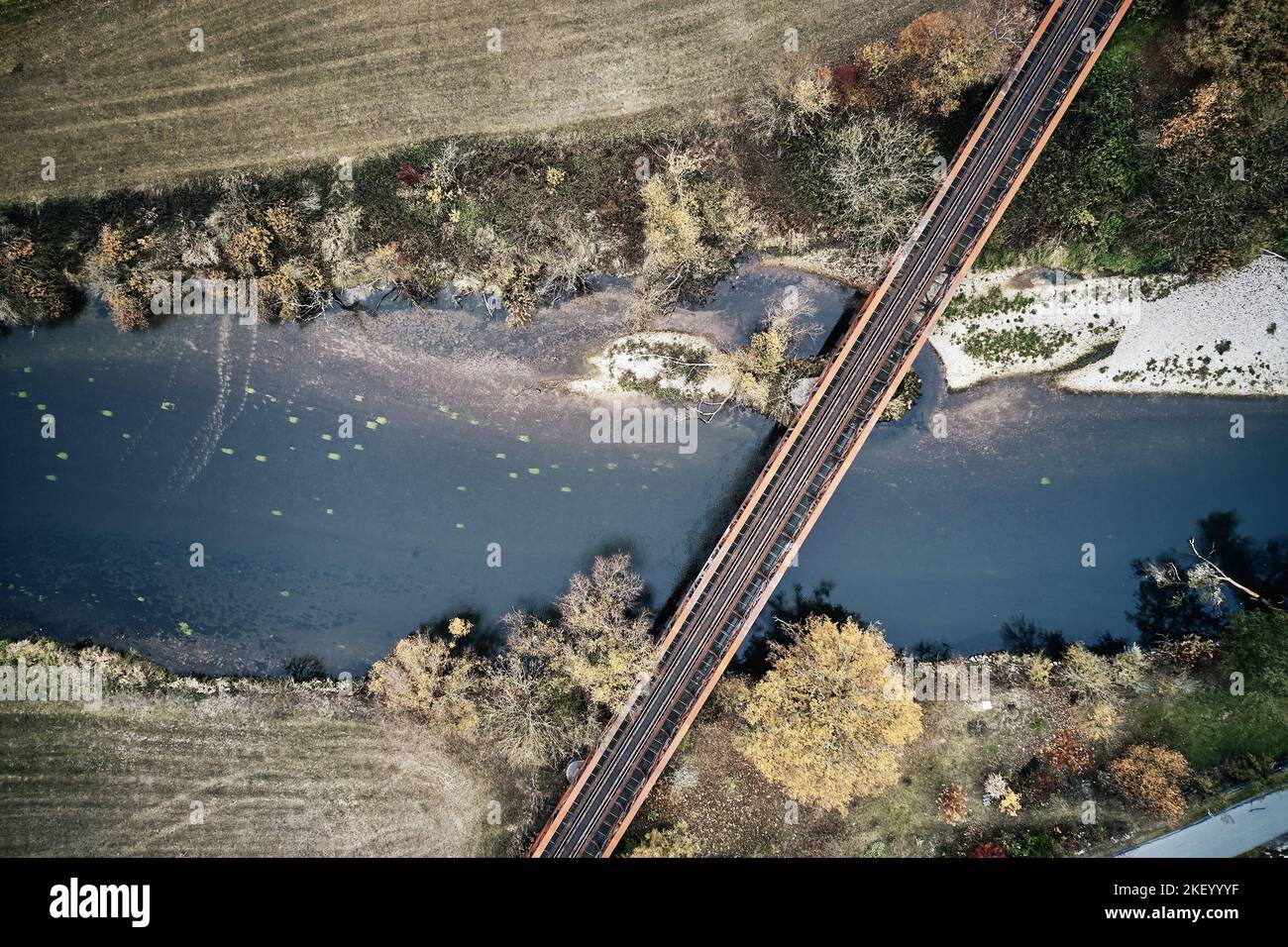 Aerial view of the railroad bridge above a river. Top view of the railroad from drone Stock ...