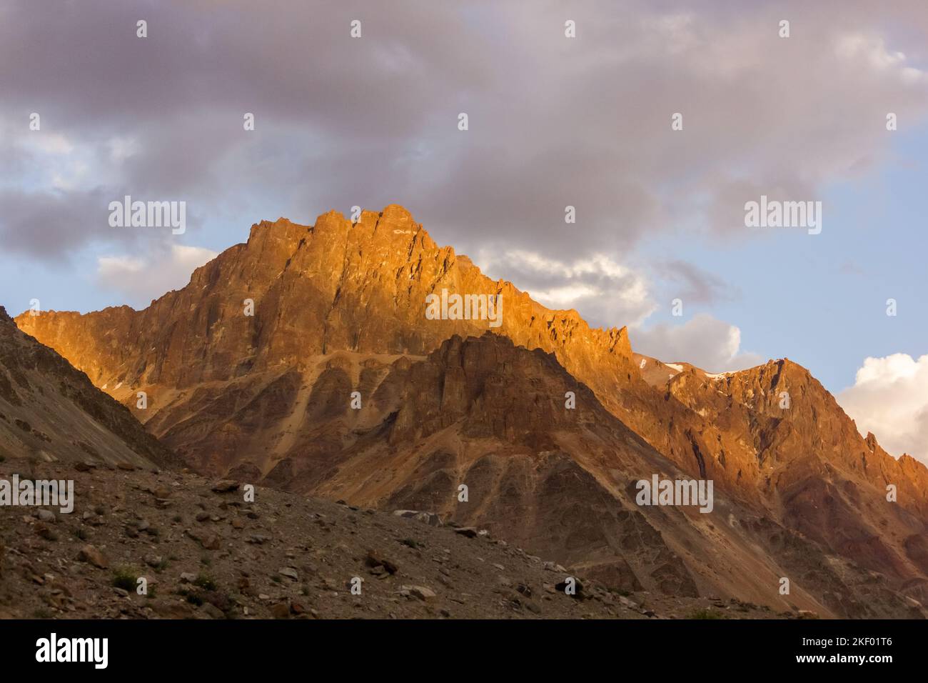 Evening light hitting the barren brown mountains of the Zanskar range ...