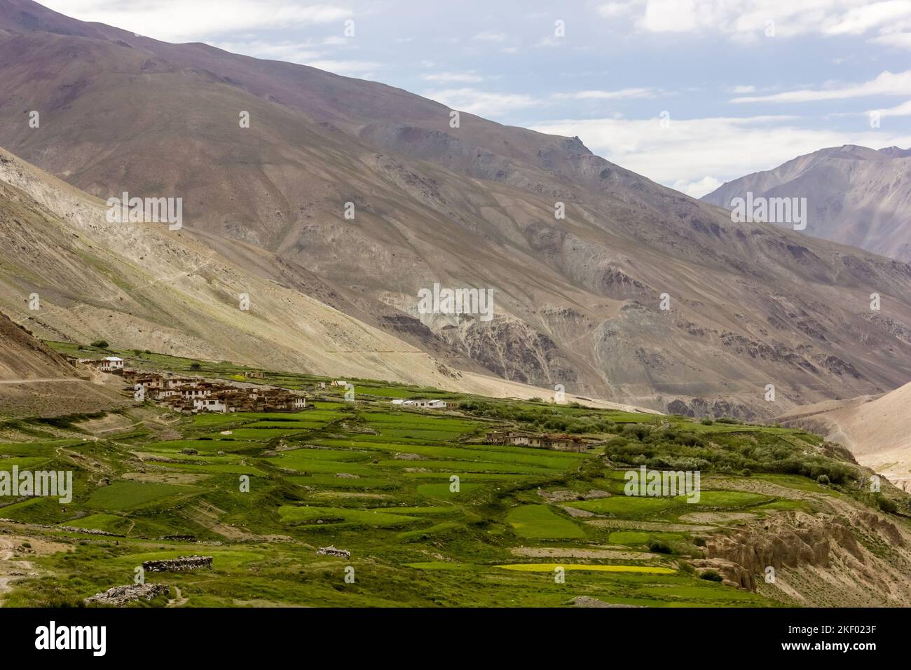 Green fields of the village of Testa surrounded by mountains in the ...