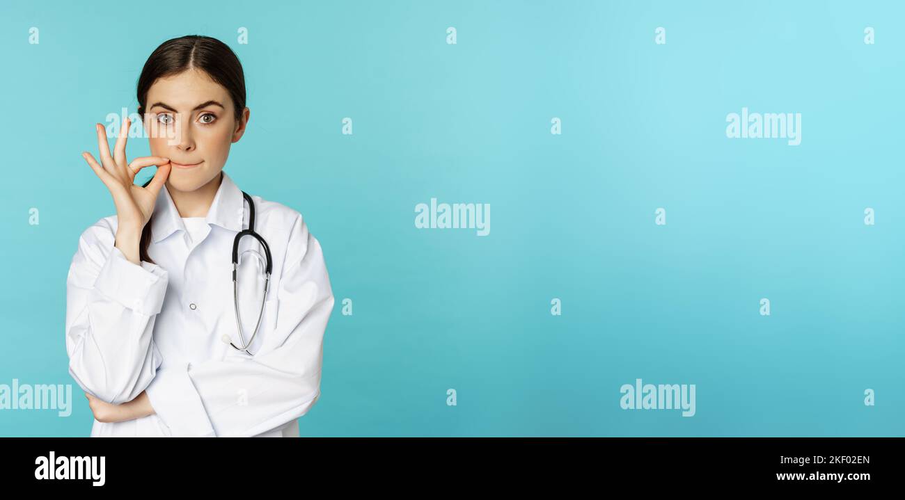 Patient doctor privilege.Young woman healthcare worker showing mouth ...