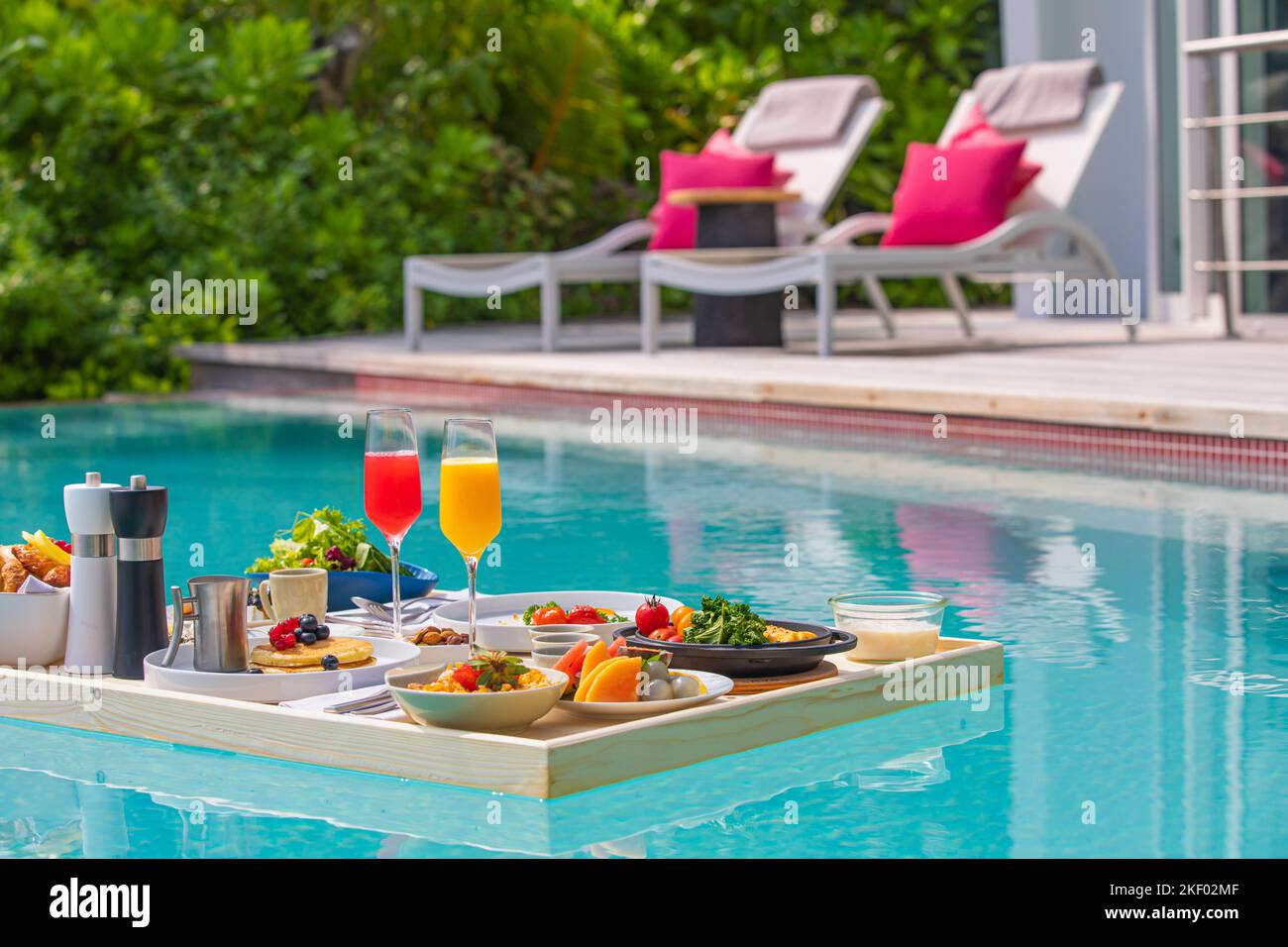 Breakfast in swimming pool floating. Luxury summer vacation or ...