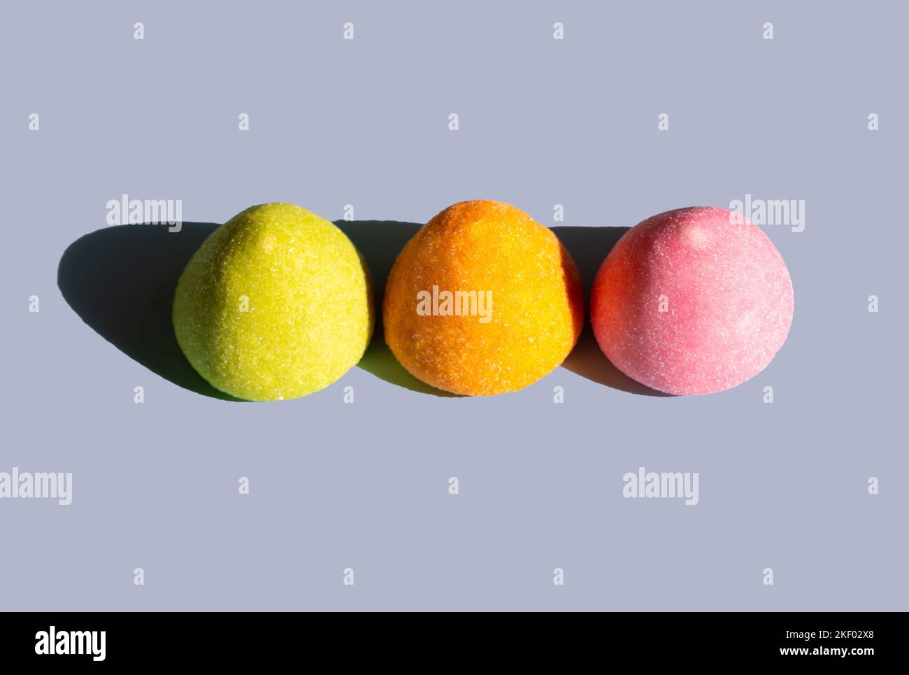 Colorful jelly candies on pastel blue baground. Color minimalism ...