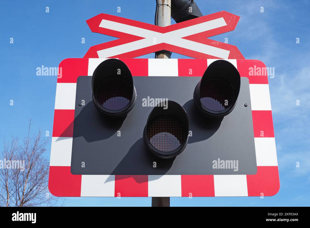 Level crossing railway warning lights and sign in Wales Stock Photo - Alamy