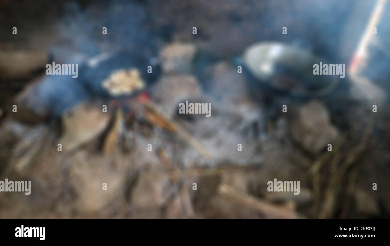 traditional cooking on stone with wood fire Stock Photo - Alamy