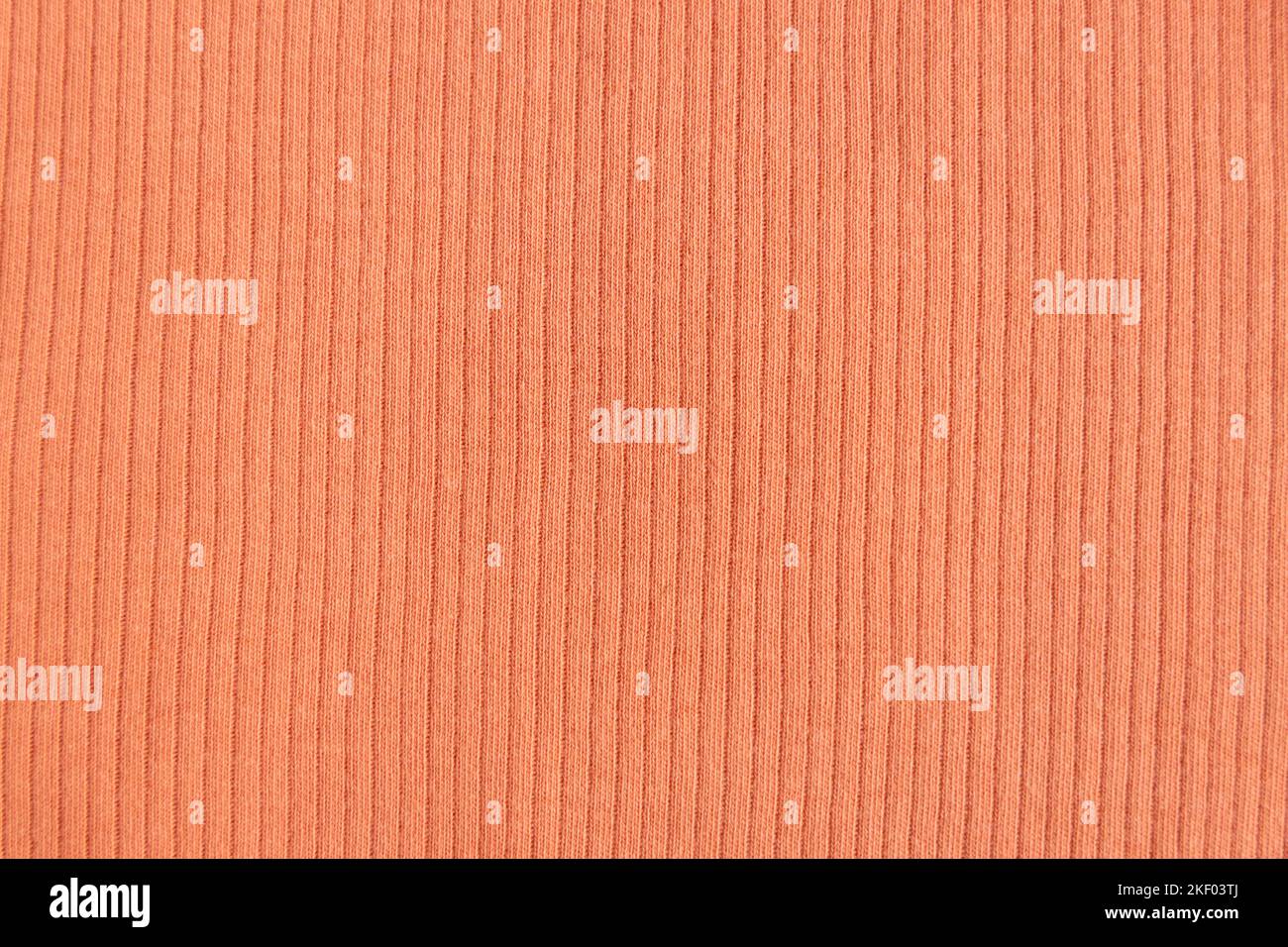 Ribbed cotton fabric texture pastel orange color . Close up rib cotton ...