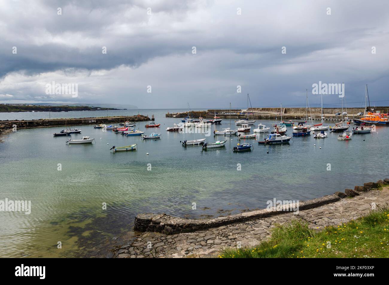 View of Portrush harbour with small boats and a lifeboat Stock Photo ...