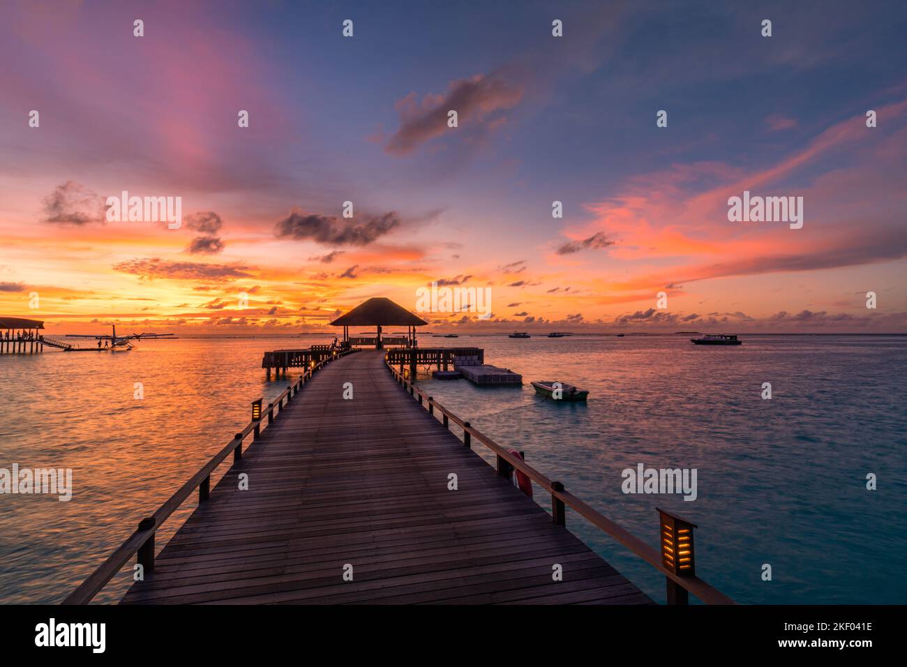 Beautiful sunset beach scene. Colorful sky and clouds view with calm ...