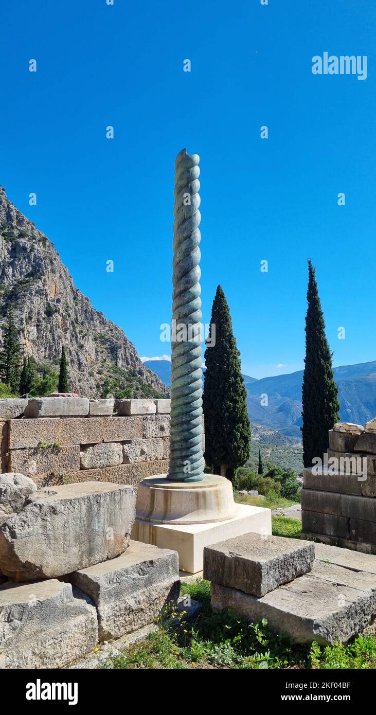 A vertical shot of the green Serpent Column in Delphic Oracle in Greece ...