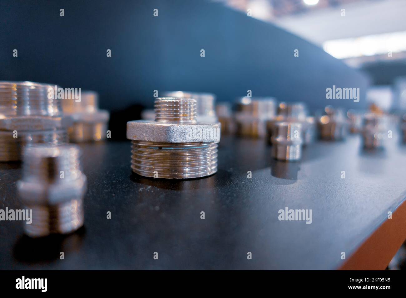 Threaded fittings. Brass nickel-plated fitting Stock Photo - Alamy