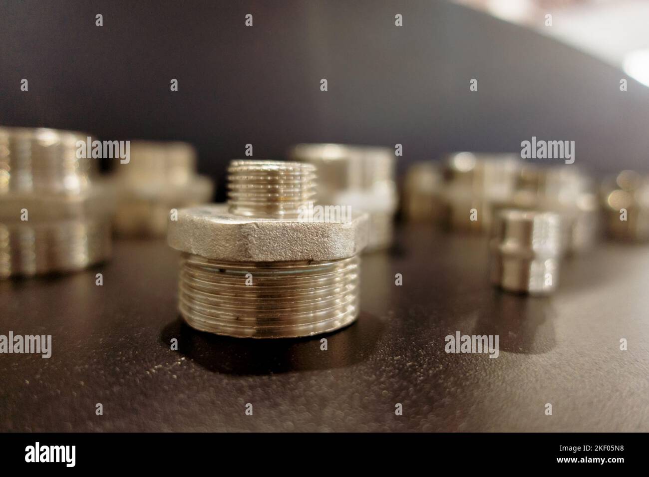 Threaded fittings. Brass nickel-plated fitting Stock Photo - Alamy