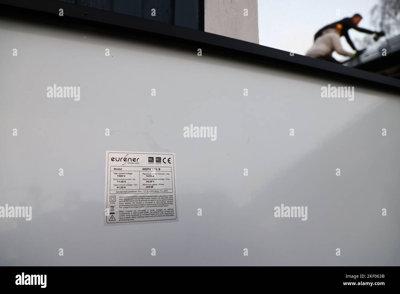 A craftsman installing solar panels on a house. In the picture: Solar ...