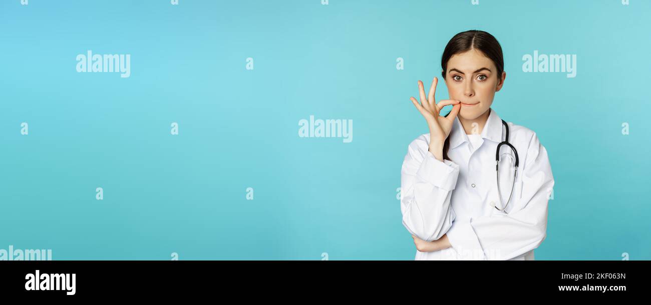 Patient doctor privilege.Young woman healthcare worker showing mouth ...