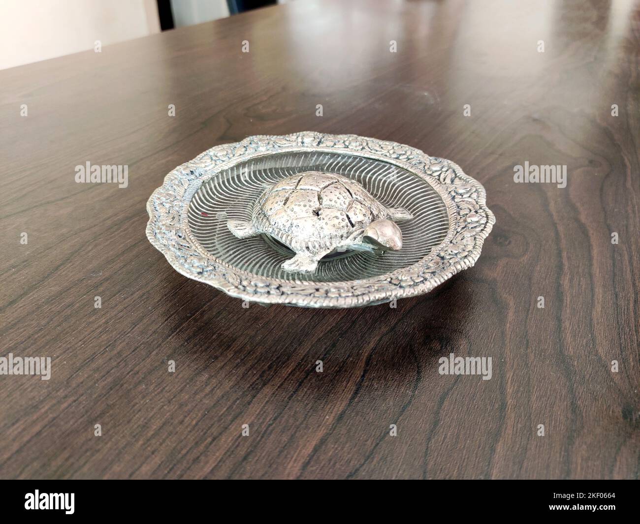 side angle Tortoise with a plate in silver plated Stock Photo - Alamy