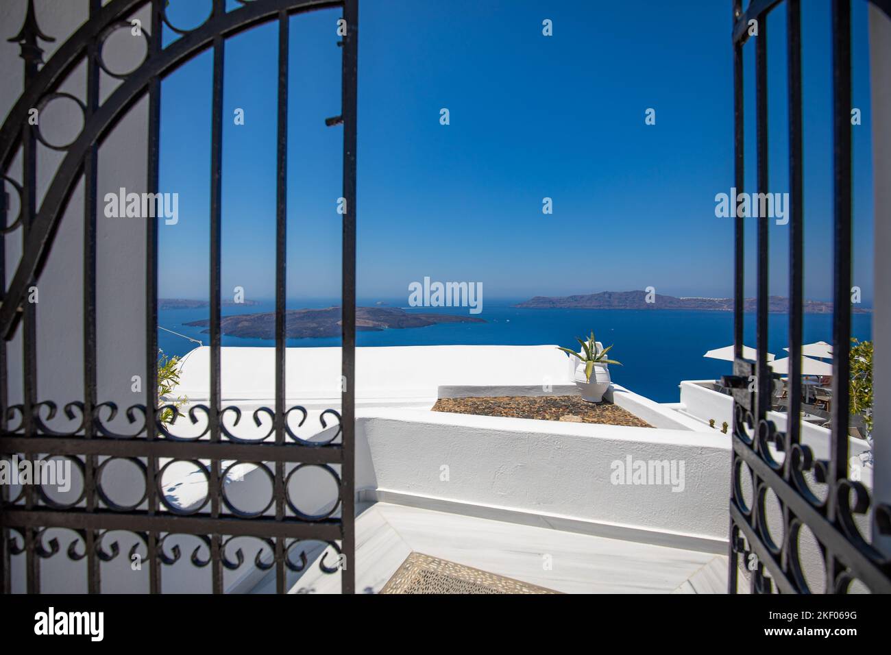 Entrance of a typical White cycladic architecture, house with blue door ...