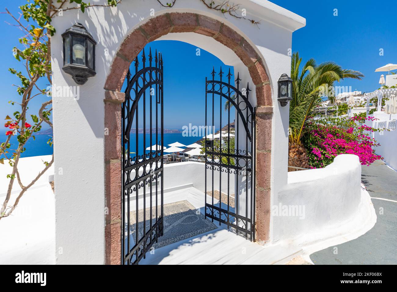 Entrance of a typical White cycladic architecture, house with blue door ...