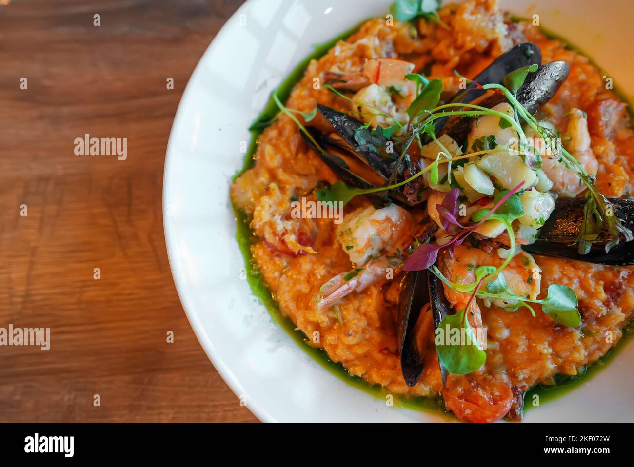 Italian risotto with seafood in restaurant Stock Photo - Alamy