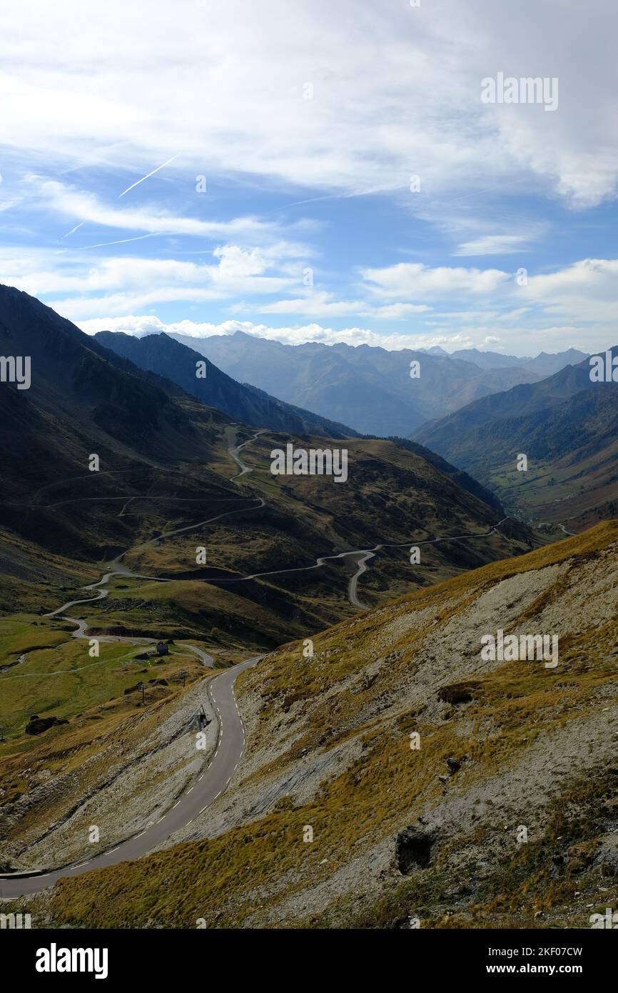 A vertical of Col du Tourmalet mountain pass under cloudy blue sky ...