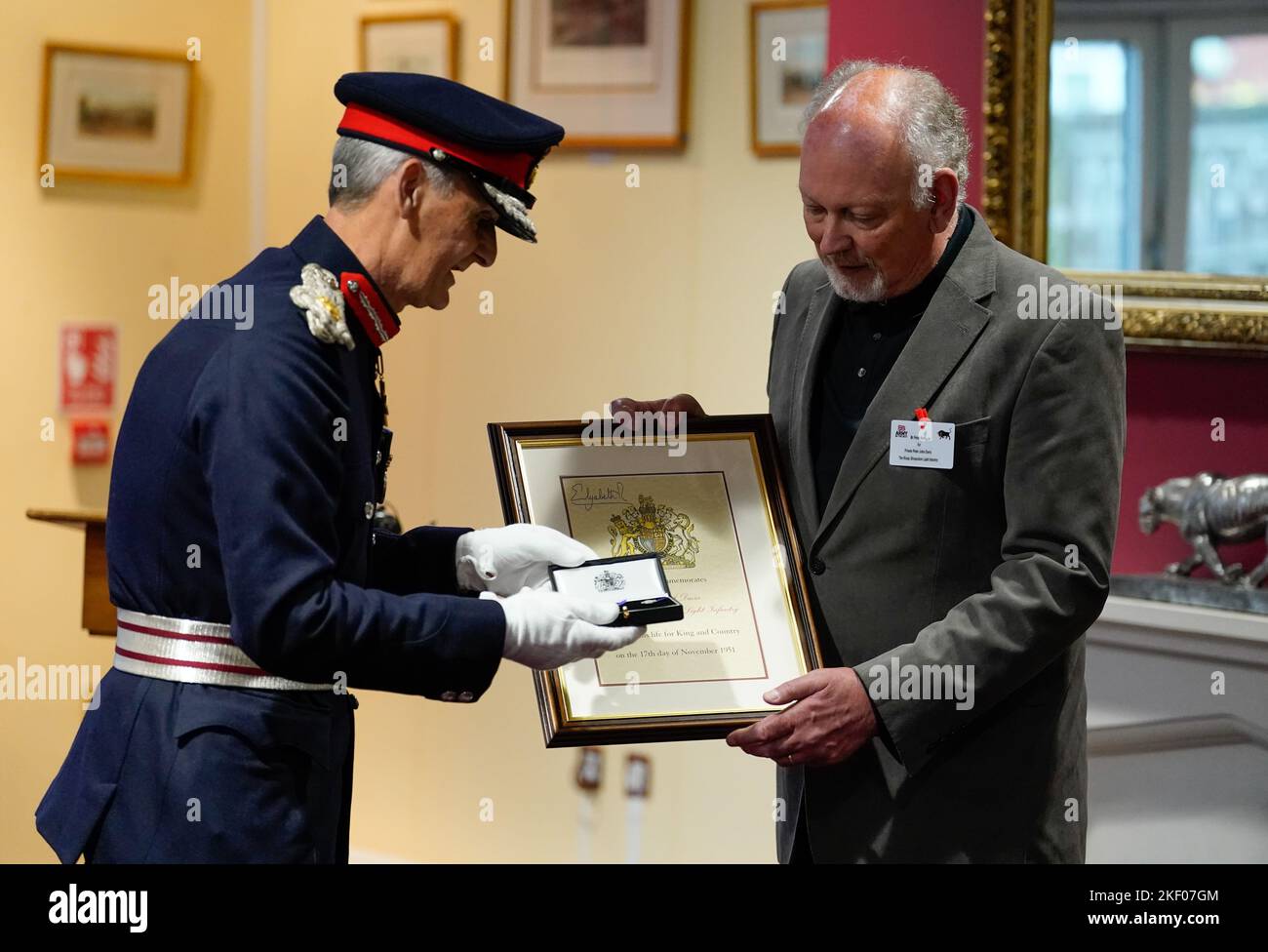 Nigel Atkinson, the Lord Lieutenant of Hampshire (left) presents Mr ...