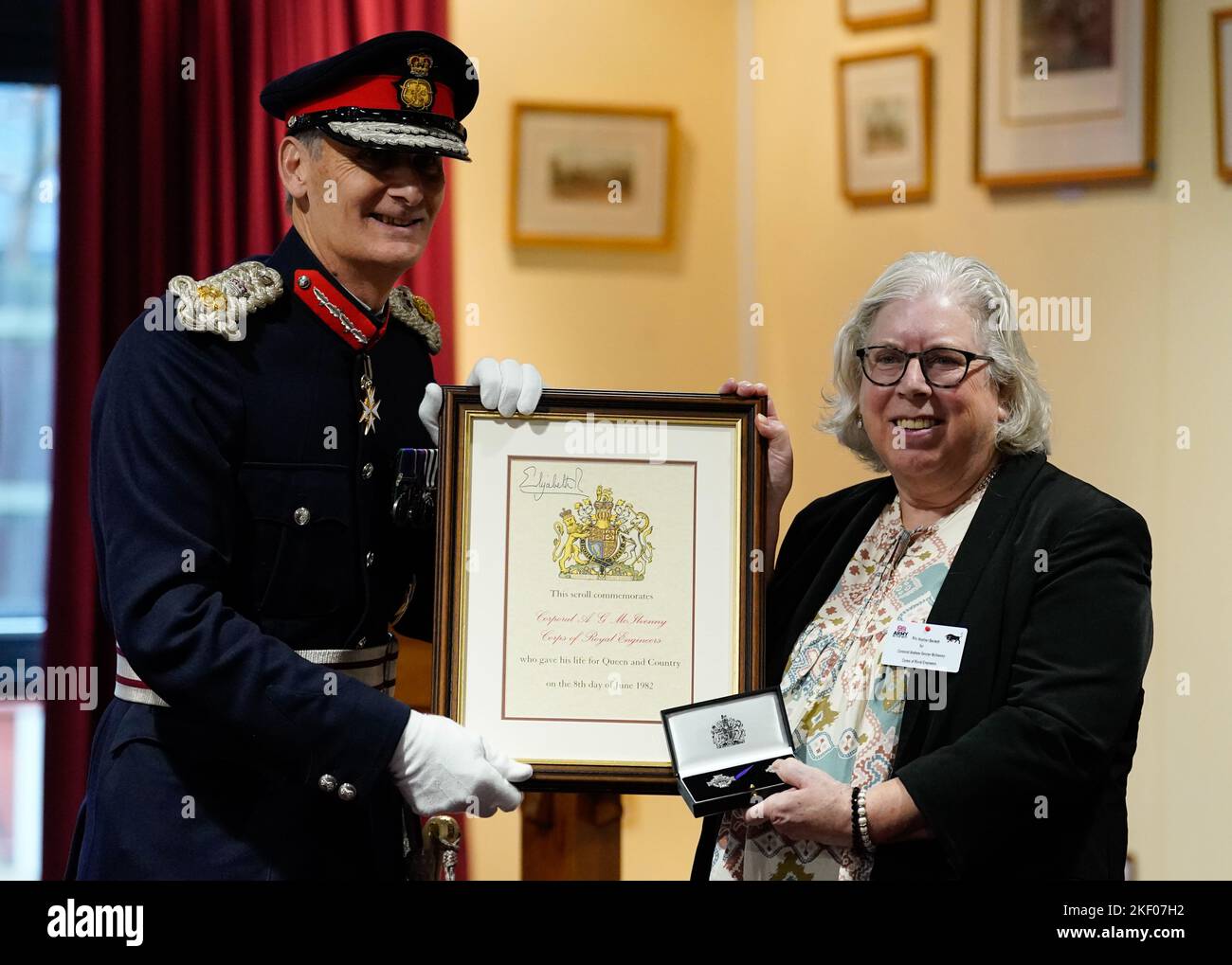 Nigel Atkinson, the Lord Lieutenant of Hampshire (left) presents Mrs ...