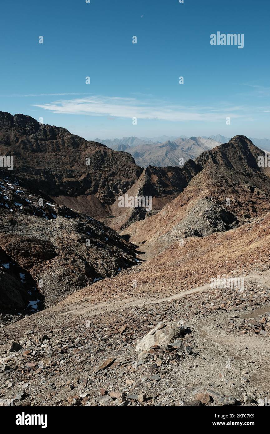 A vertical of a rocky Pyrenean trail under a clear blue sky Stock Photo ...