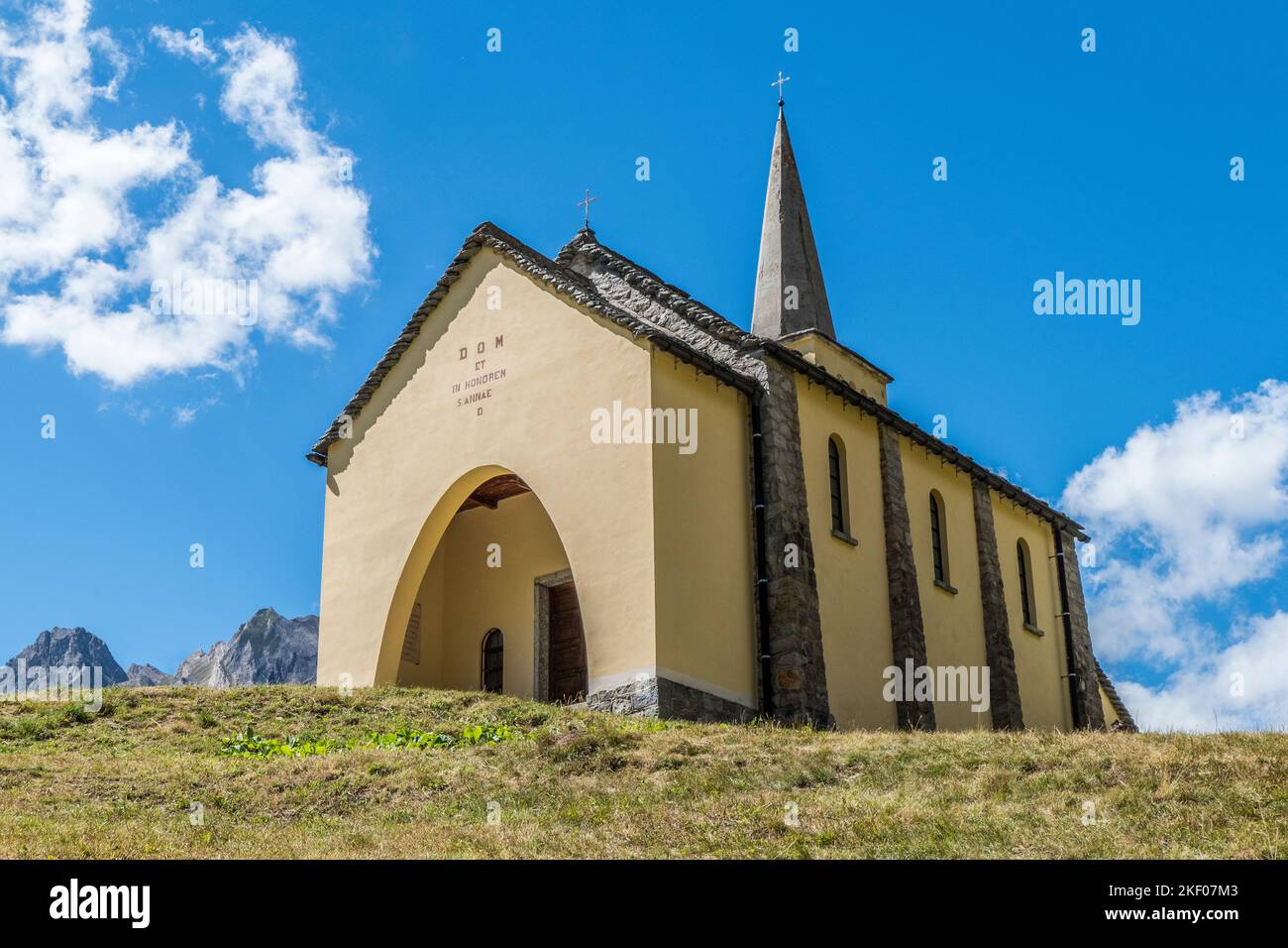beautiful little catholic church on top of a hill in the mountains in ...