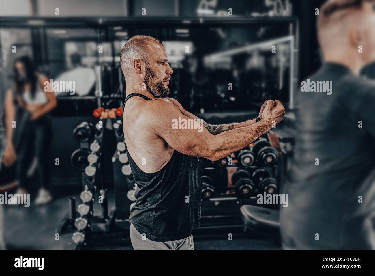 coach showing how to perform the exercise correctly Stock Photo - Alamy