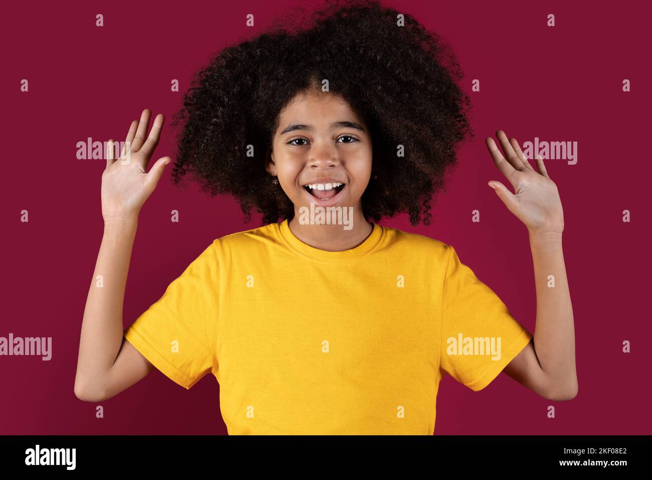 Emotional black child raising hands up and screaming Stock Photo - Alamy