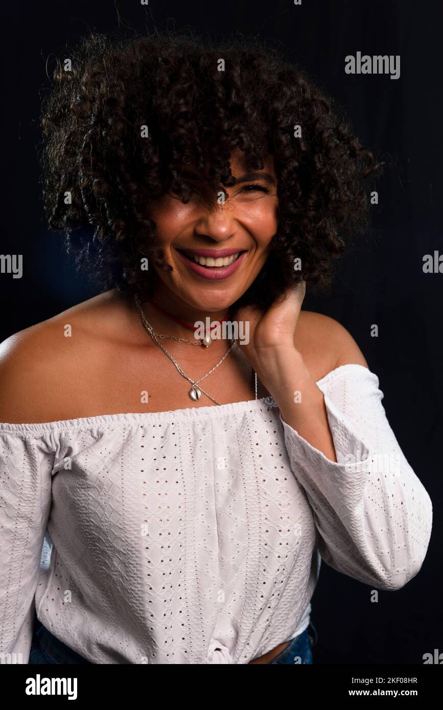 Beautiful woman portrait against black background. Mature woman. Self ...