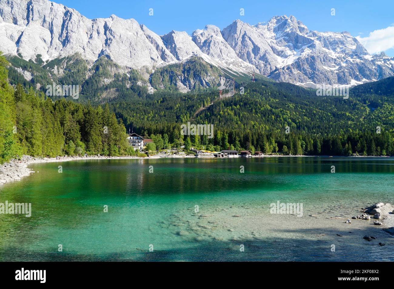 hiking trail overlooking picturesque turquois alpine lake Eibsee by the ...