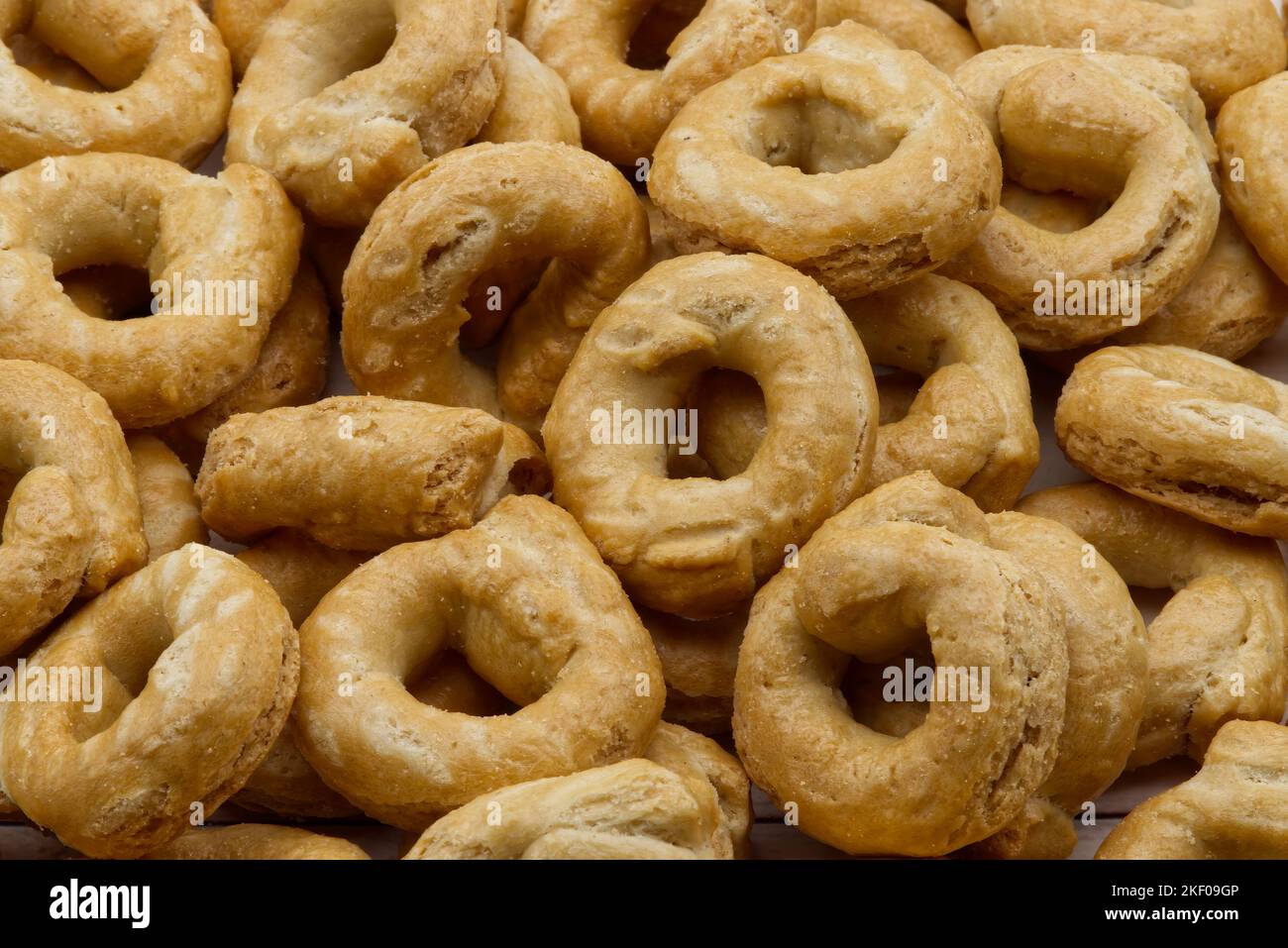 Taralli alla pugliese with extra virgin olive oil background ...