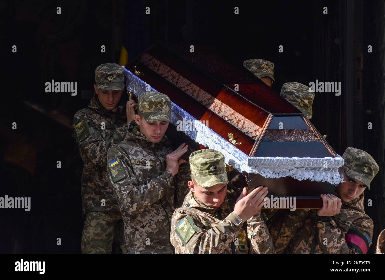Lviv, Ukraine. 18th Oct, 2022. Soldiers carry coffins with the bodies ...