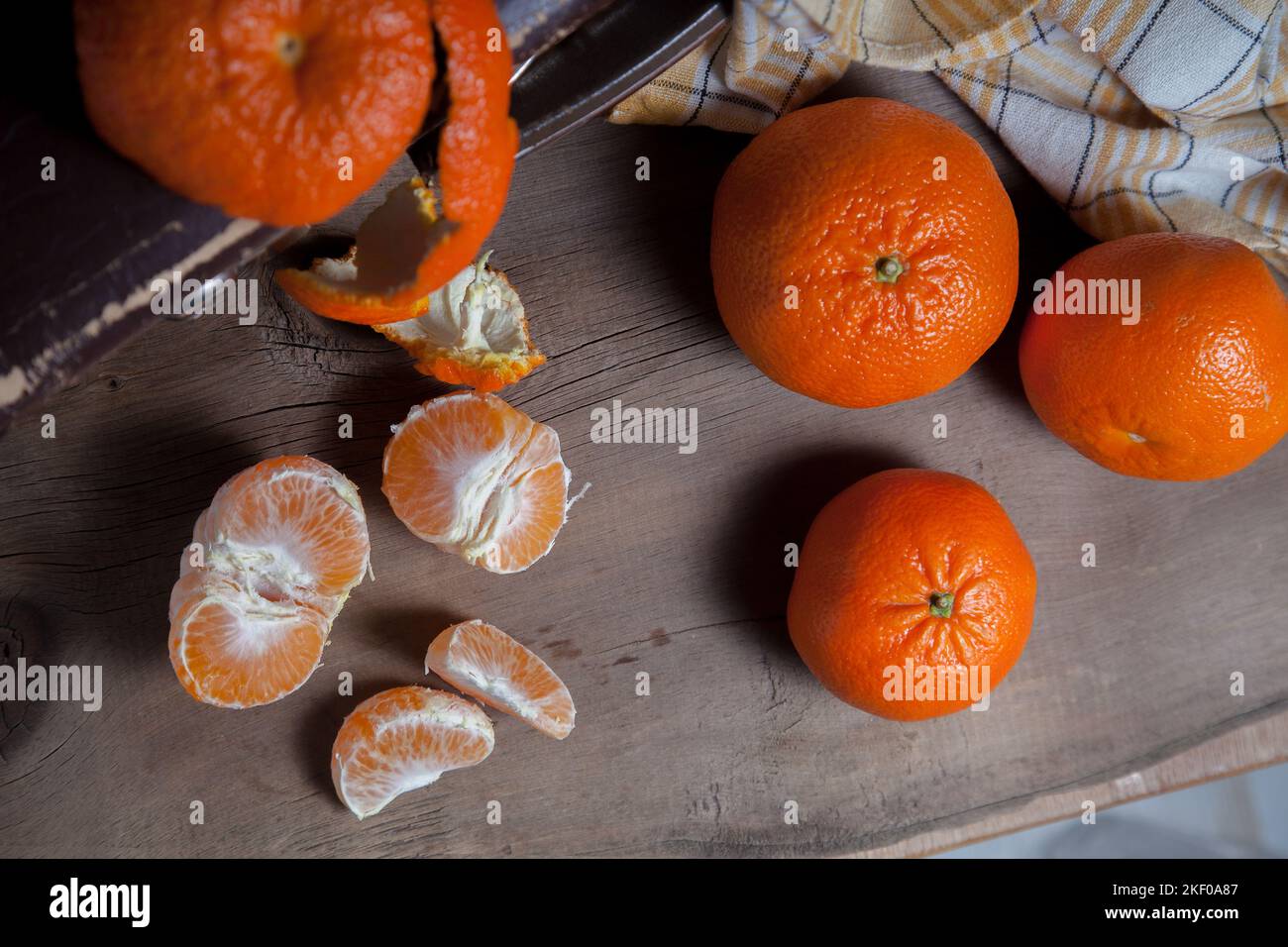 Several of unpeeled whole fresh orange mandarine or oranges, tangerines, clementines, citrus ...