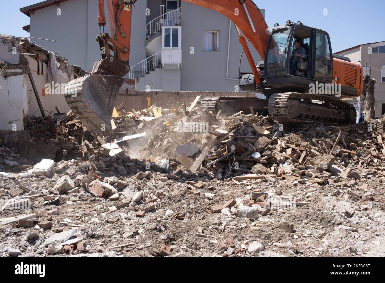 Urla, Turkey - may 13, 2020 : excavator loading debris of a destroyed ...